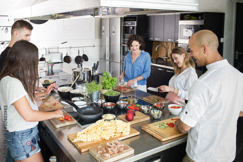smiling people cooking together Stock Photo | Adobe Stock