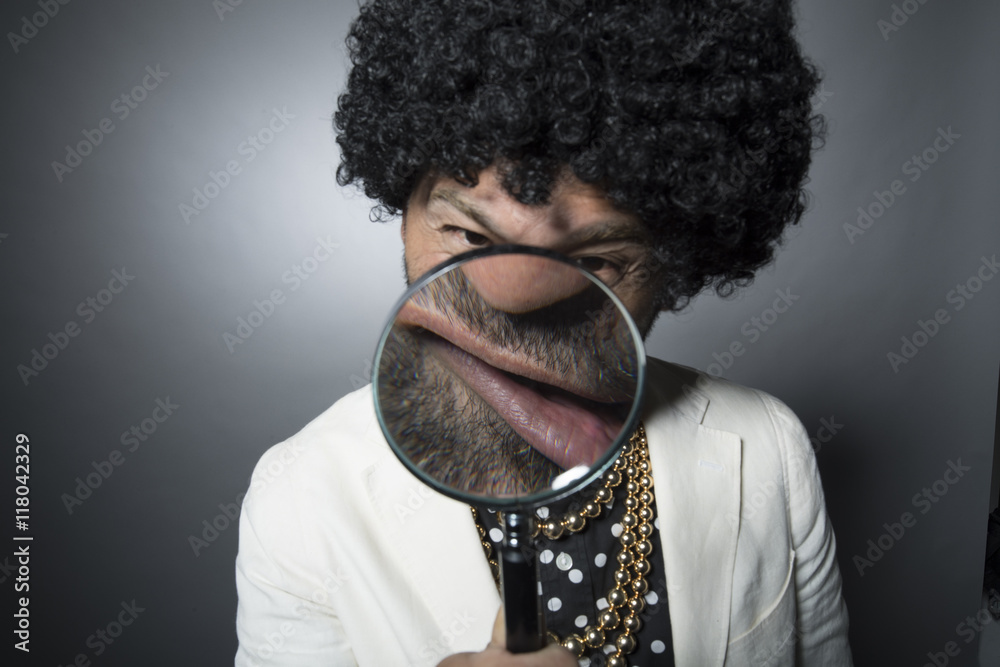 Men who are expanding the mouth with a magnifying glass Stock Photo ...