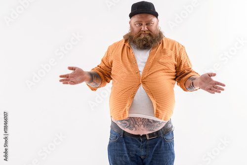 Man wearing a shirt that is too small on him - Buy this stock photo and ...