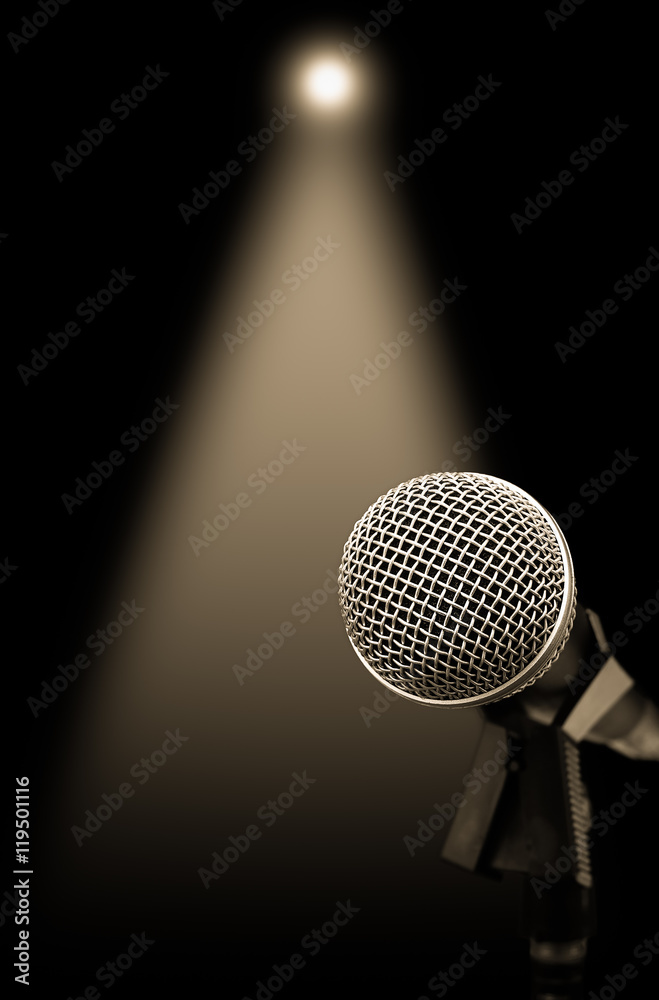 dynamic microphone on stage with spotlight for music background Stock ...