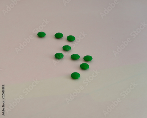 Small green pills Stock Photo | Adobe Stock