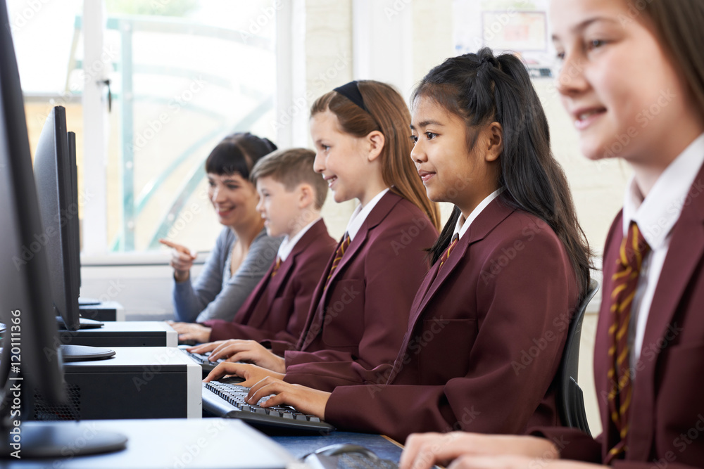 Pupils In Computer Class With Teacher Stock Photo | Adobe Stock