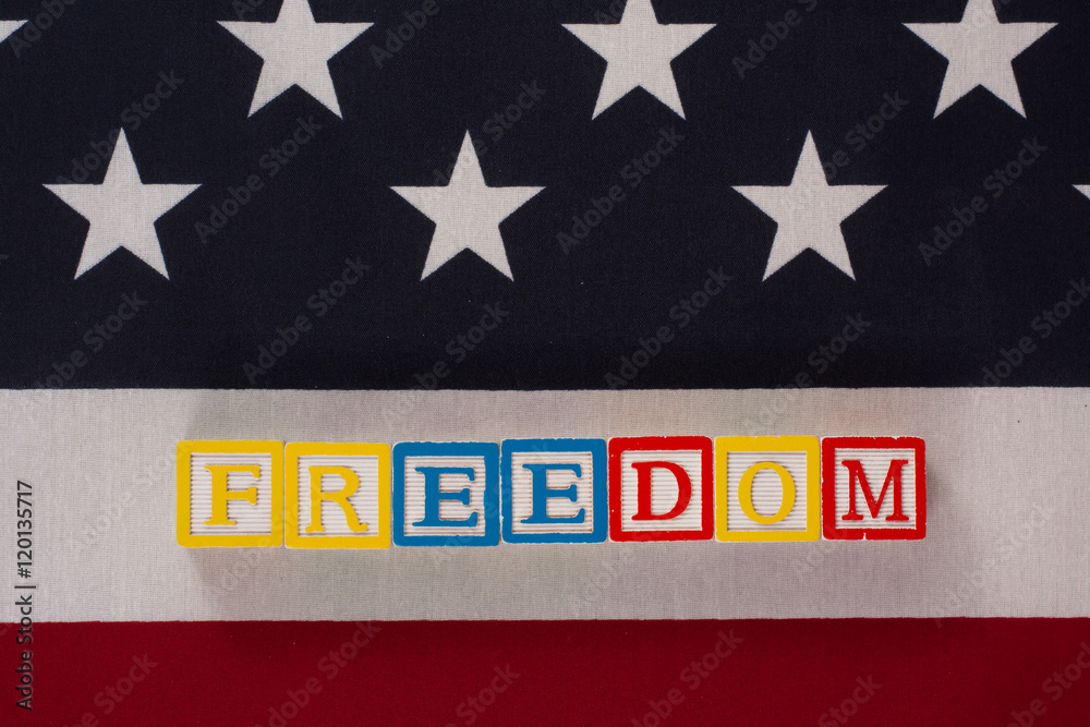 American freedom! The word freedom spelled out on letter blocks on top ...