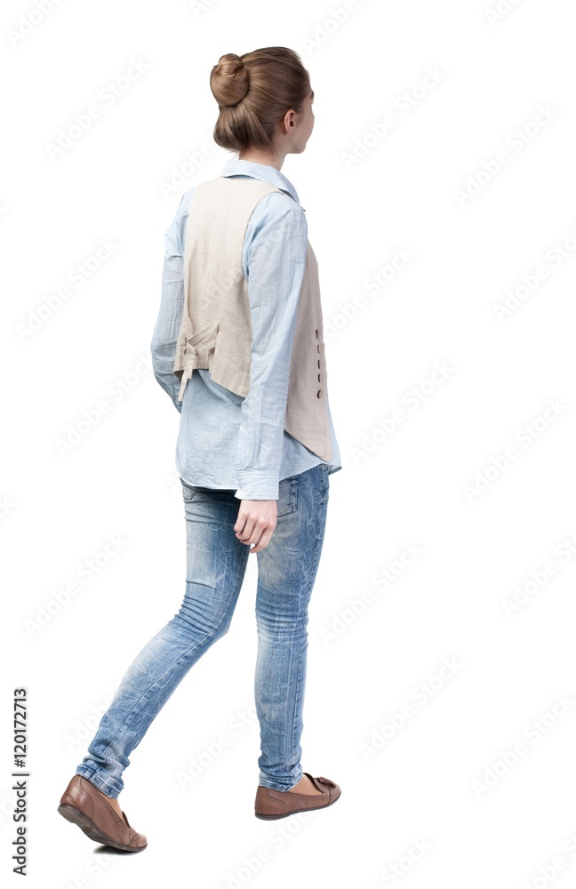 back view of walking woman in vest. beautiful girl in motion. backside ...
