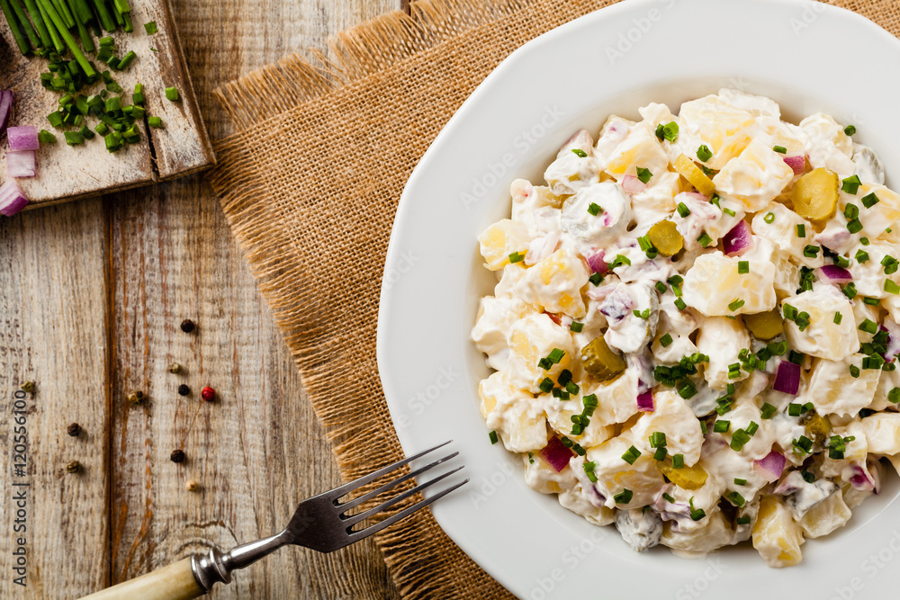 Traditional German potato salad with cucumber, onion and mayonna Stock ...