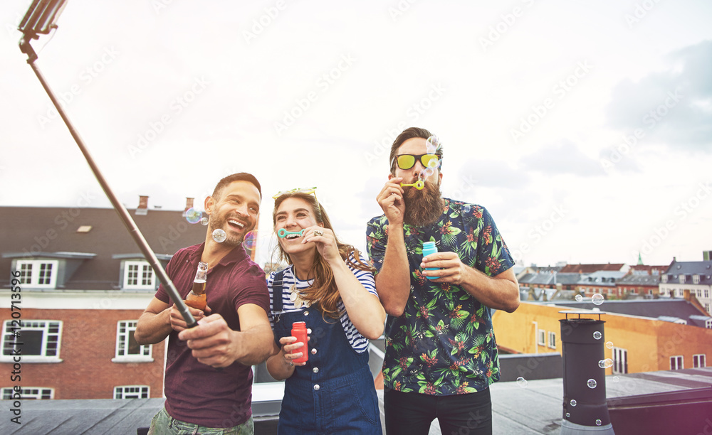 Three drunk friends taking pictures Stock Photo | Adobe Stock