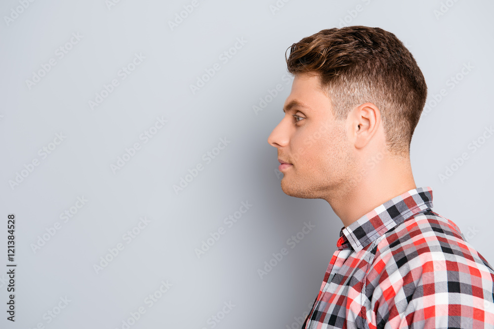 Profile of handsome smiling young man on gray background Stock Photo ...