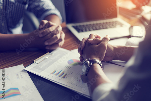 Hand, two men on a desk. Negotiating business. Stock Photo | Adobe Stock