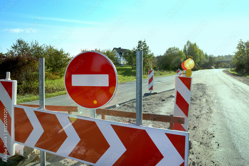 No entry traffic sign on road. Prohibiting sign, white arrow on red ...