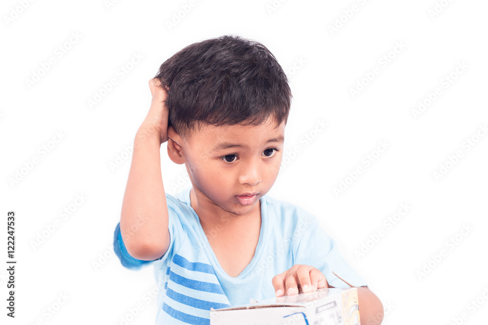 Cute child asian little boy scratching head Stock Photo | Adobe Stock
