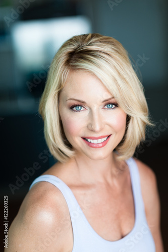 Attractive blond woman real estate agent business representative ... Attractive blond woman real estate agent business representative ...