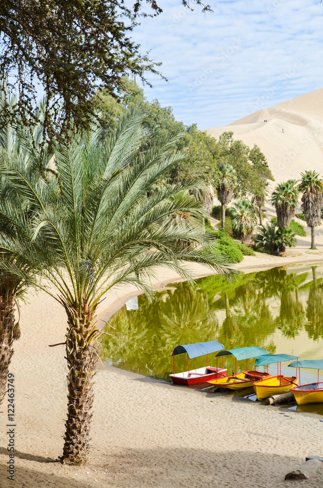 Oasis- Huacachina, a village in southwestern Peru, built around a small ...