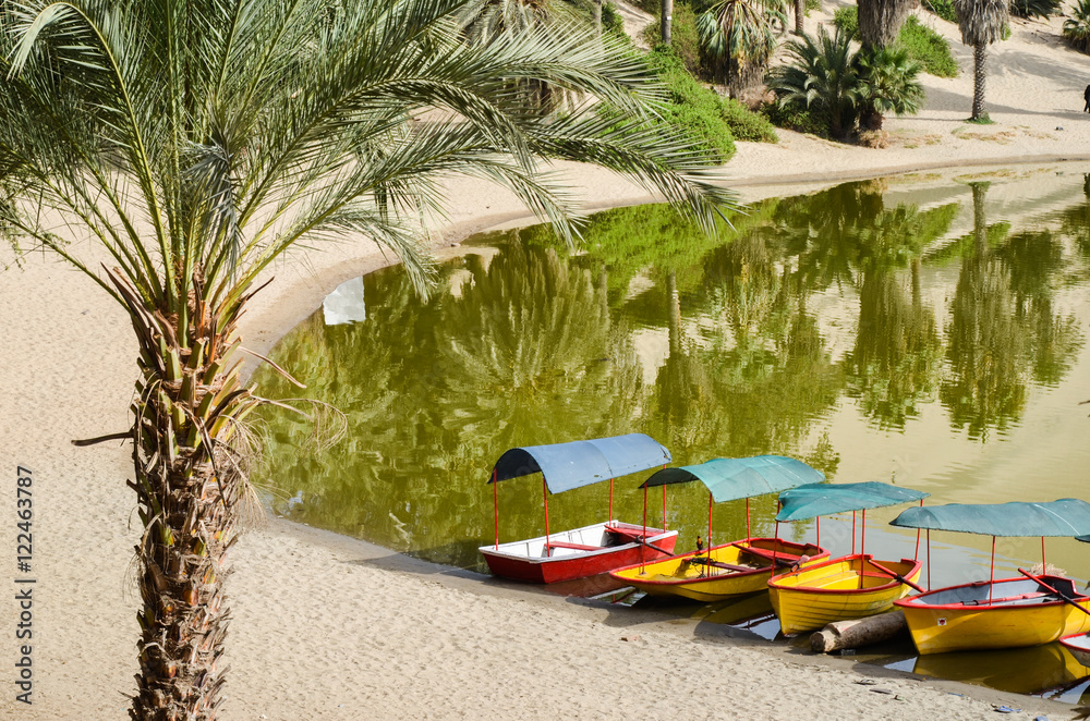 Oasis- Huacachina, a village in southwestern Peru, built around a small ...