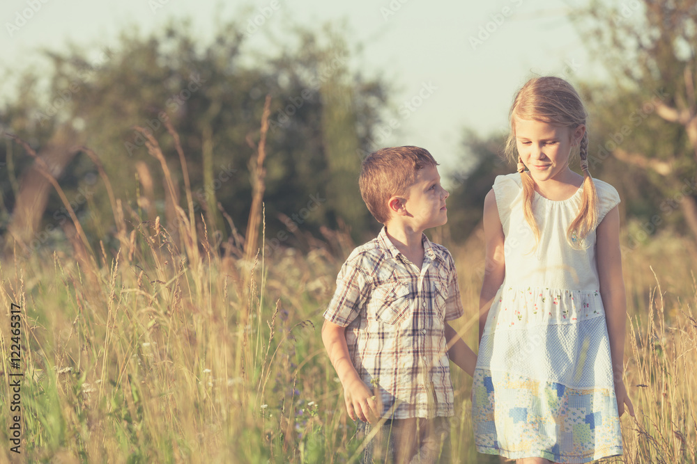 Two happy children playing on the road Stock Photo | Adobe Stock