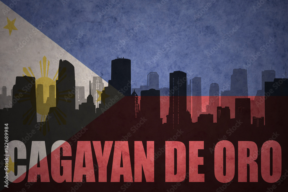 abstract silhouette of the city with text Cagayan de Oro at the vintage ...