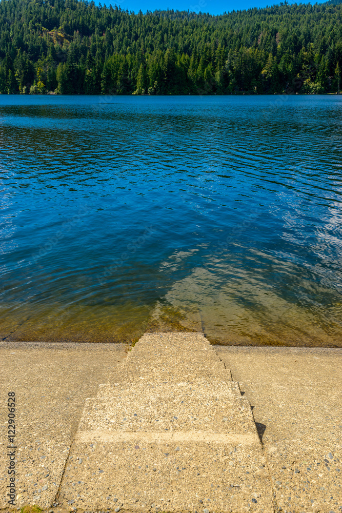 Beautiful Lake Cowichan in Canada. Stone stairs leading to the lake ...