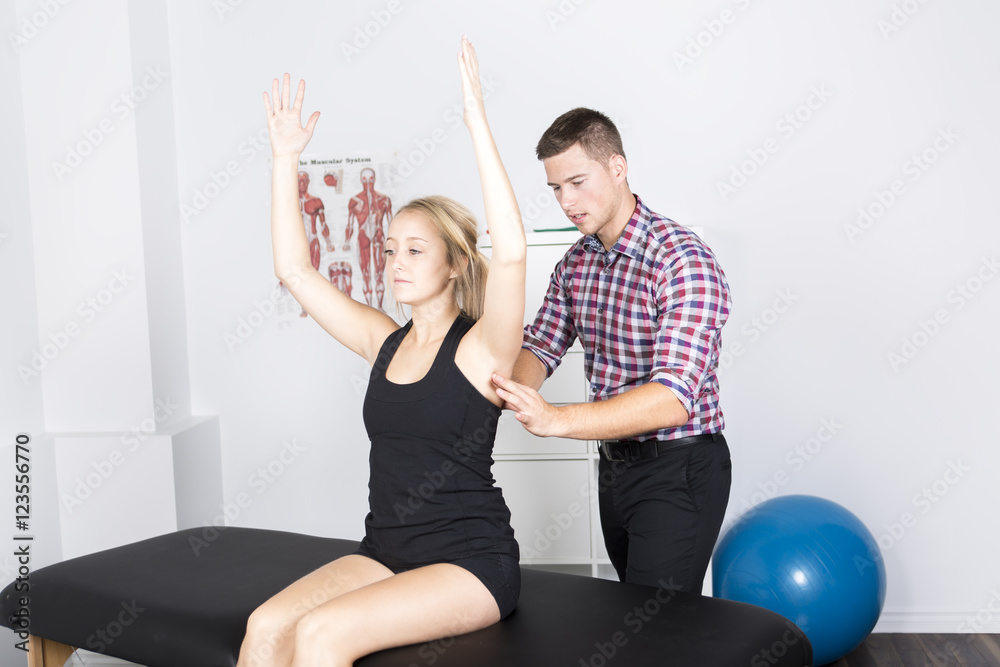 male physio therapist and woman helping patient Stock Photo | Adobe Stock