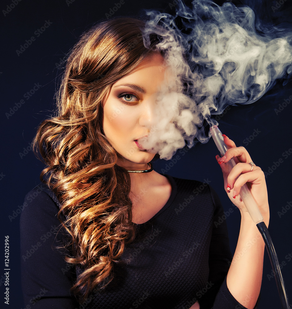 Young, beautiful girl in club dress and perfect make up smoke a Stock ...