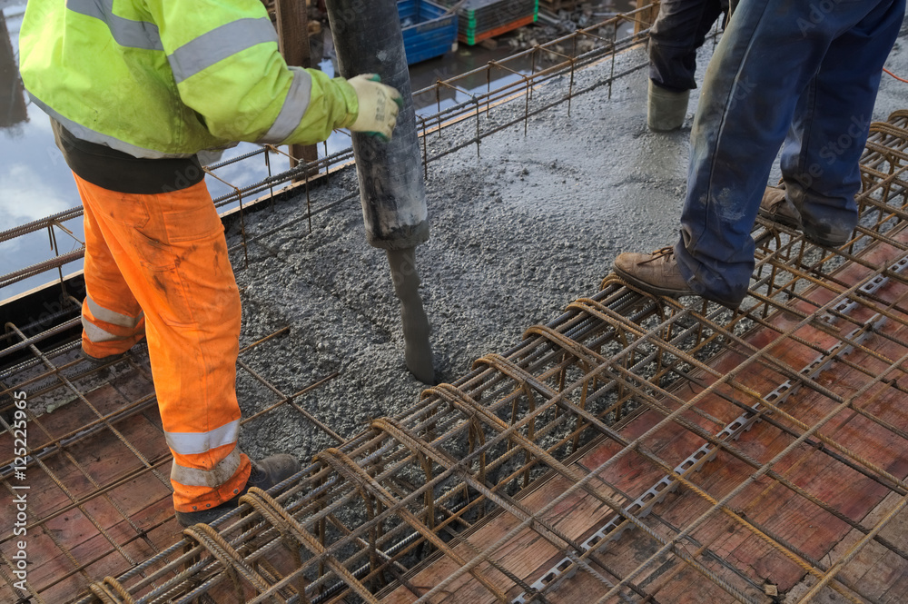 Concreting of slab pouring concrete engineering construction with rebar ...