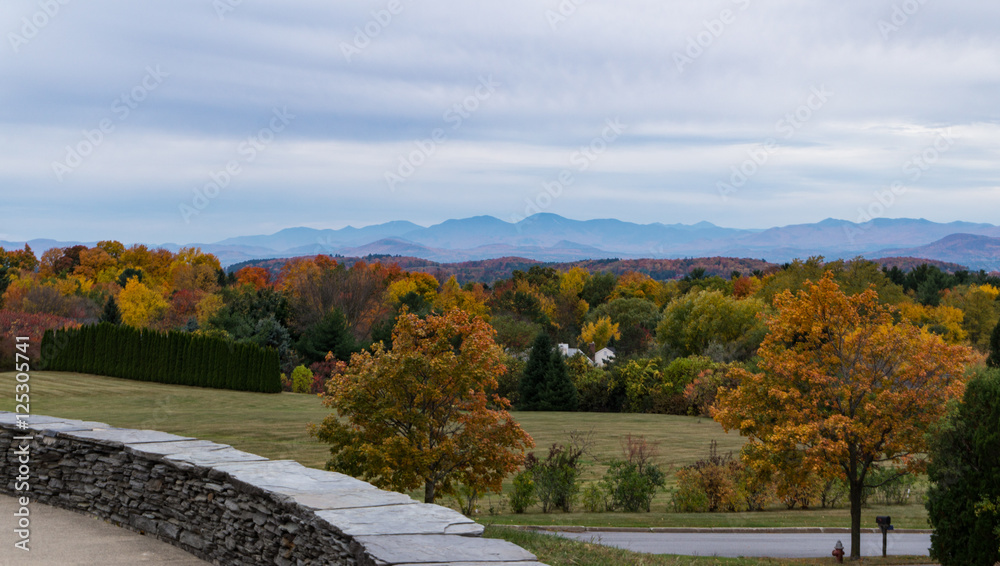 view of fall foliage and Adirondack Mountains in New York from Overlook ...