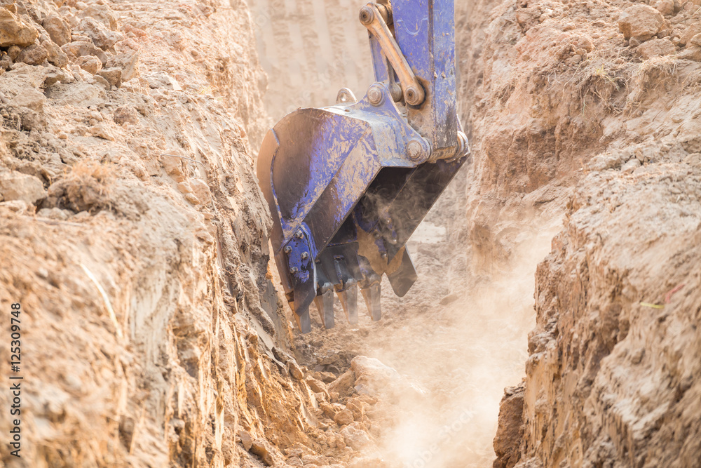 Working Excavator Tractor Digging A Trench. Stock Photo | Adobe Stock
