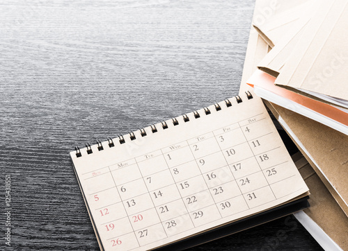 Calendar. With Stack of papers paperwork. Stock 사진 | Adobe Stock