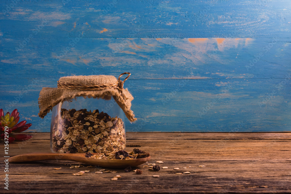 Cereals bowl and bottle on a wooden table.When he woke up, the sun ...