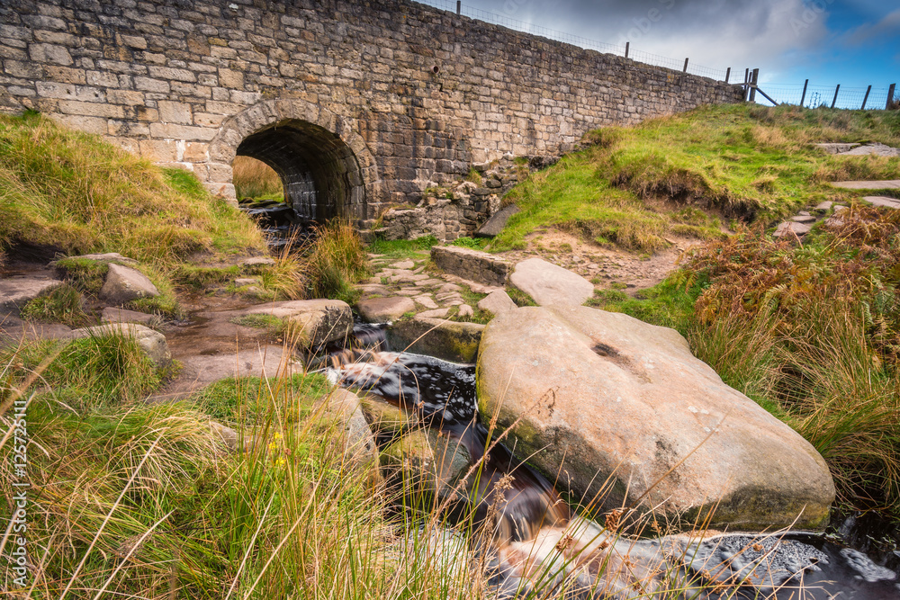 Upper Burbage Bridge east, with Burbage Brook flowing under it, in the ...