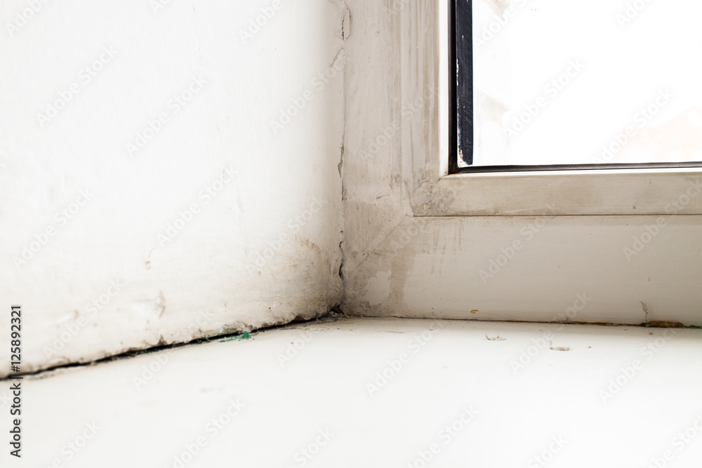 The crack between the sill window and the wall due to the deformation ...
