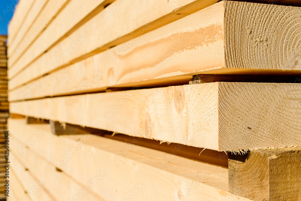 Corner parts of stacked lumber or timber. Stock Photo | Adobe Stock