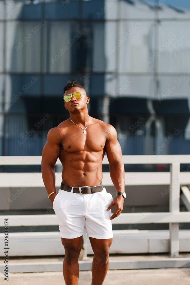Hot Beautiful black guy with bulging muscles posing against the ...