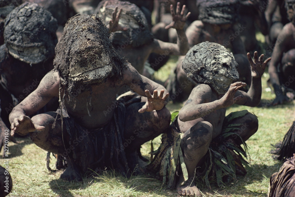 Mud men wearing clay masks perform ritual dance, Asaro Valley, Papua ...