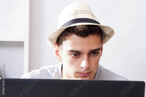 young man behind the computer screen working Stock Photo | Adobe Stock