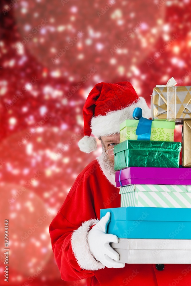 Composite image of santa claus hiding behind stack christmas gif Stock ...