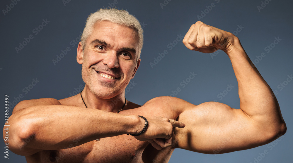 Strong Man Fitness Model showing flexing bicep muscle (Healthy l Stock ...