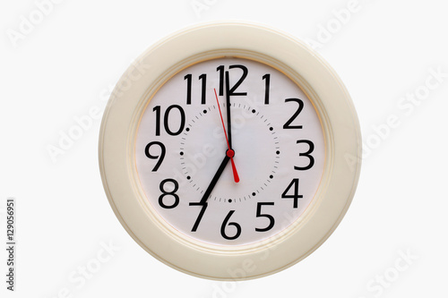 Analog wall clock showing 7:00 o'clock Stock Photo | Adobe Stock