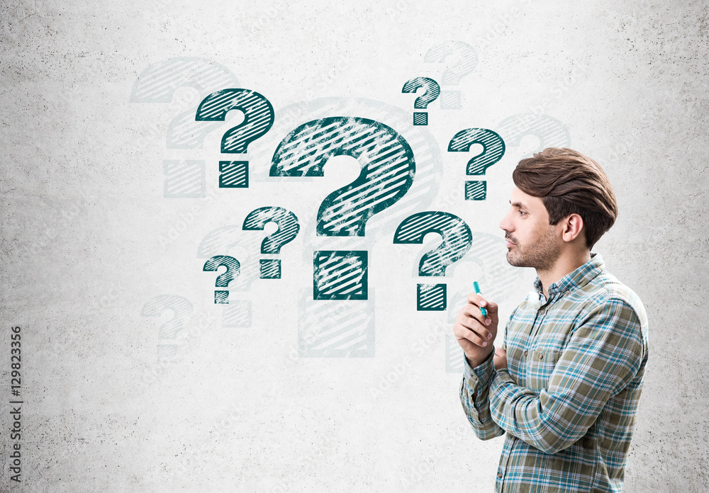 Side view of man with marker and question marks Stock Photo | Adobe Stock