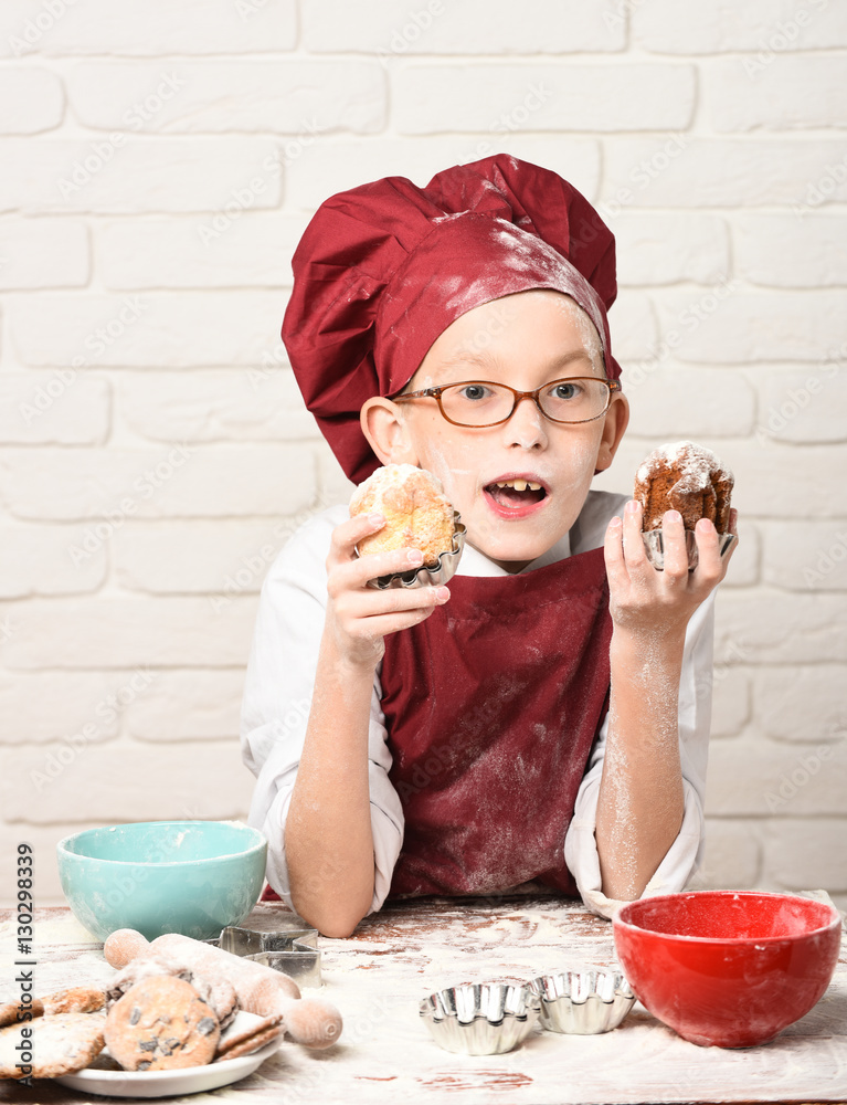 Foto de Stock stained cute cook chef boy | Adobe Stock