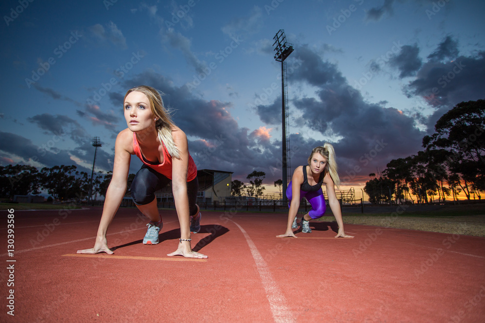 Beautiful female fitness model stretching and training on athlet Stock ...