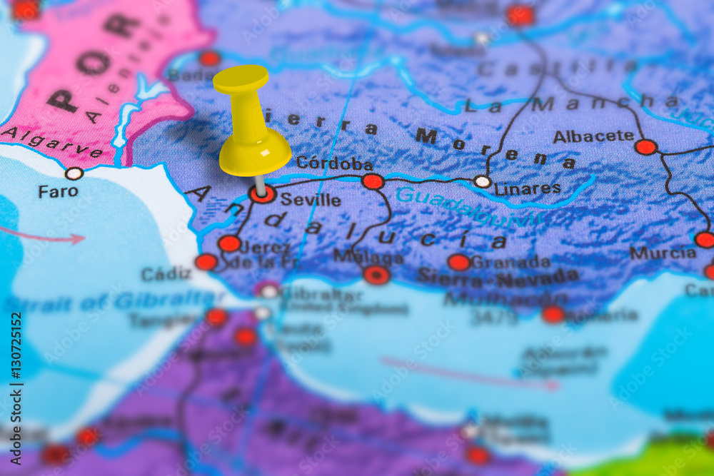 Seville in Spain pinned on colorful political map of Europe ...
