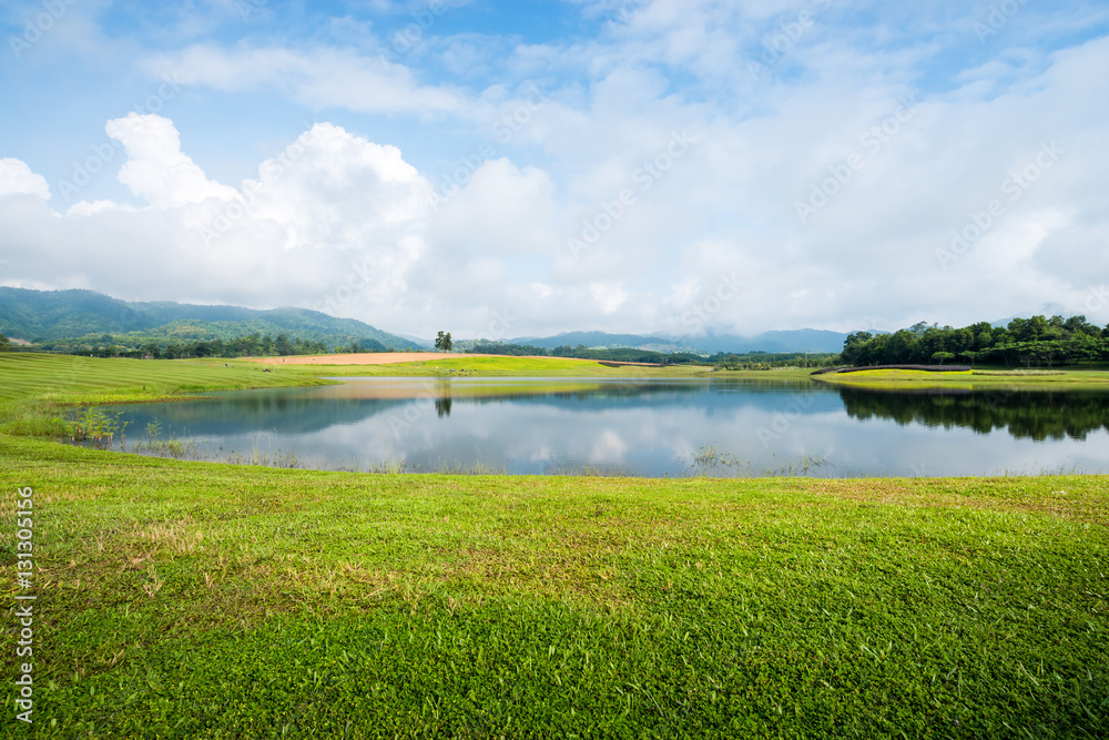 grass field with lake Stock Photo | Adobe Stock