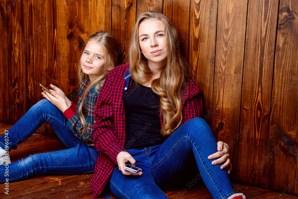 Photo Stock two sisters together | Adobe Stock