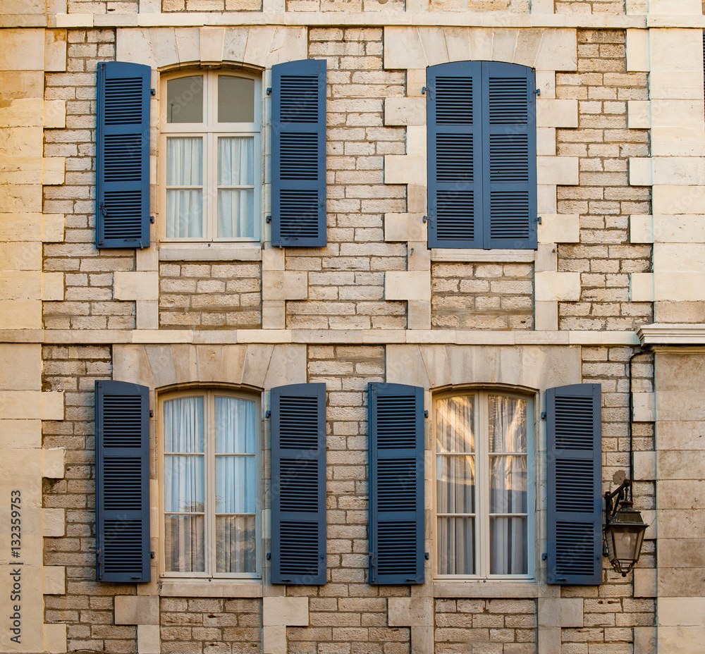 Vintage building facade wall of a french building in modern style with ...
