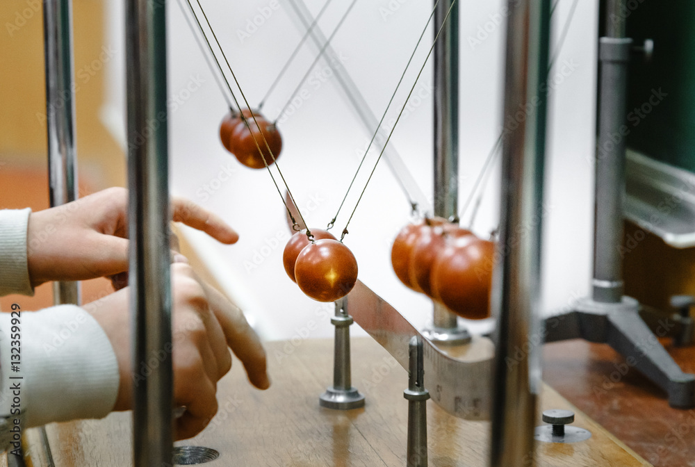 Experiment with balls in laboratory. Research concept. Conservation of ...