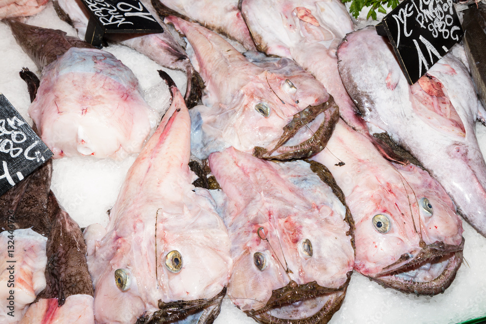 Ice chilled skinned angler monkfish on a fish market stand. Stock Photo ...