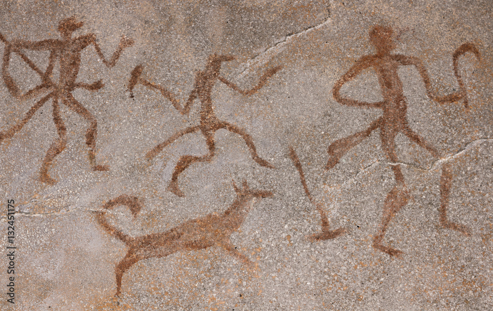 Drawing on a rock cave wall ocher paint, ancient prehistoric ...
