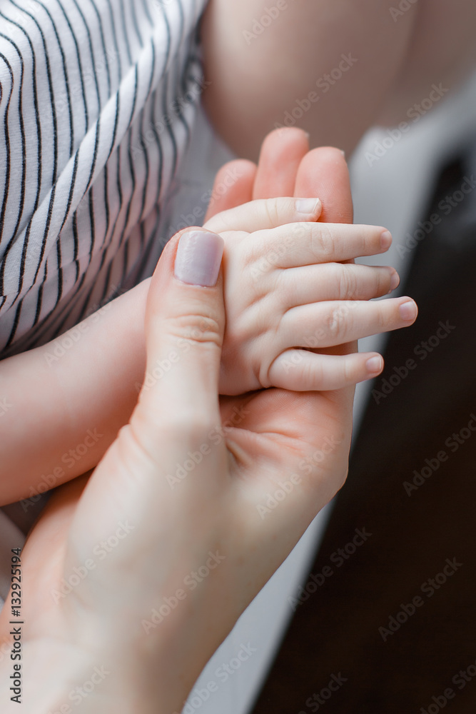 My mother's big pink hand, with a white mother-of-pearl manicure ...