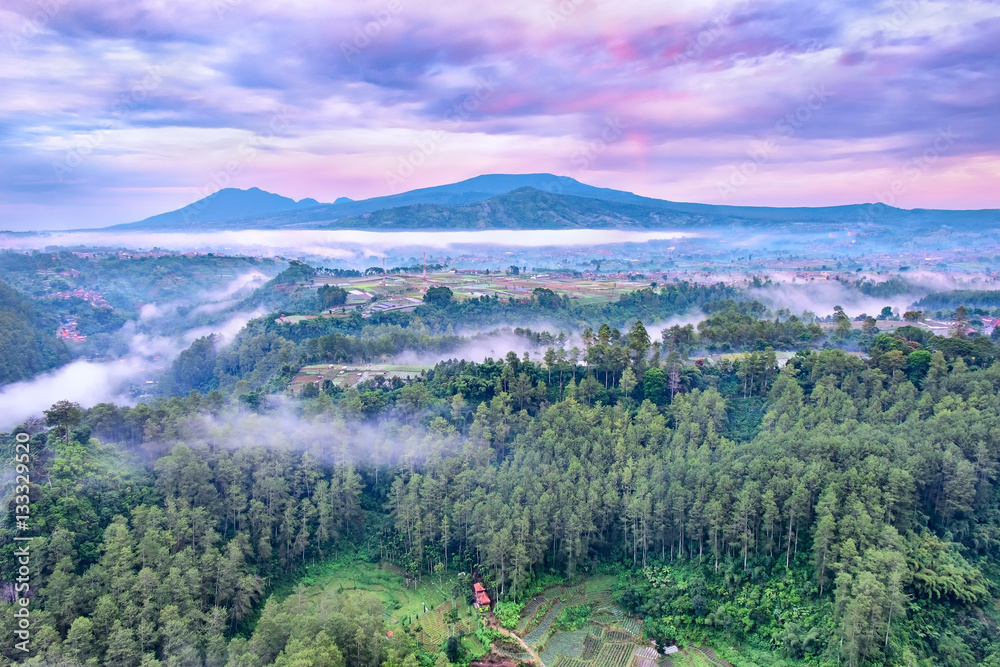 Aerial view of forest and colors of Indonesia, captured at sunrise ...