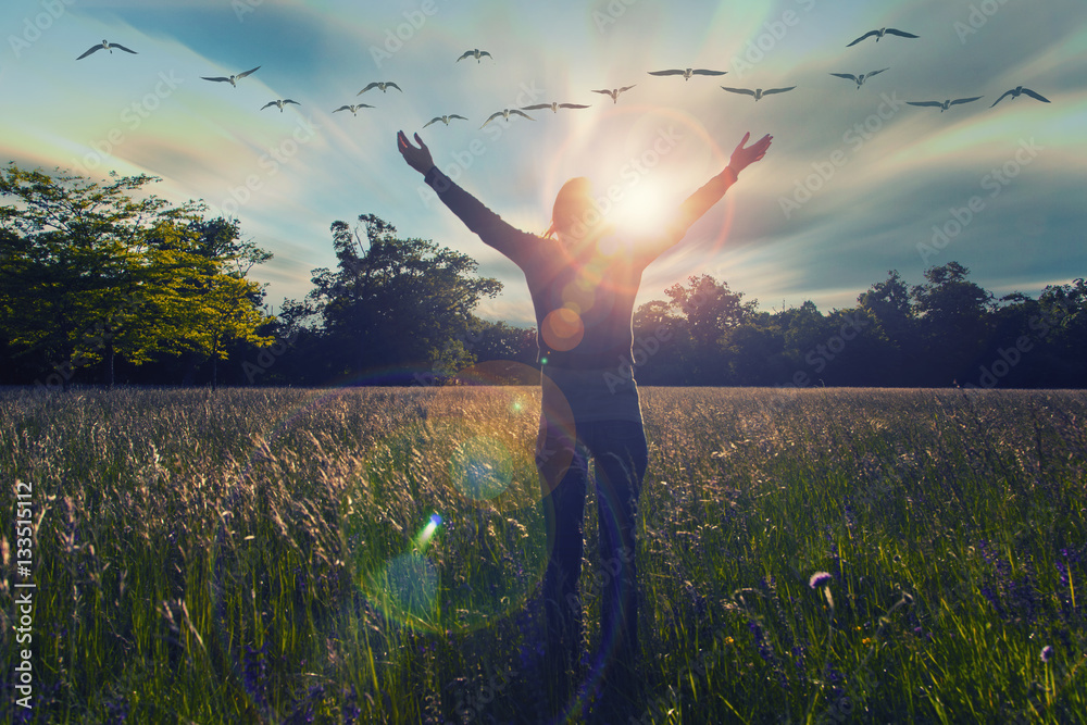 Young girl spreading hands with joy and inspiration facing the sun,sun ...
