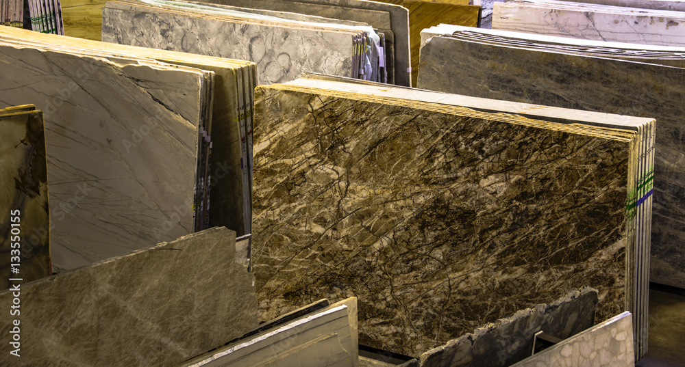 colorful samples of marble and granite counters in shop. the most ...